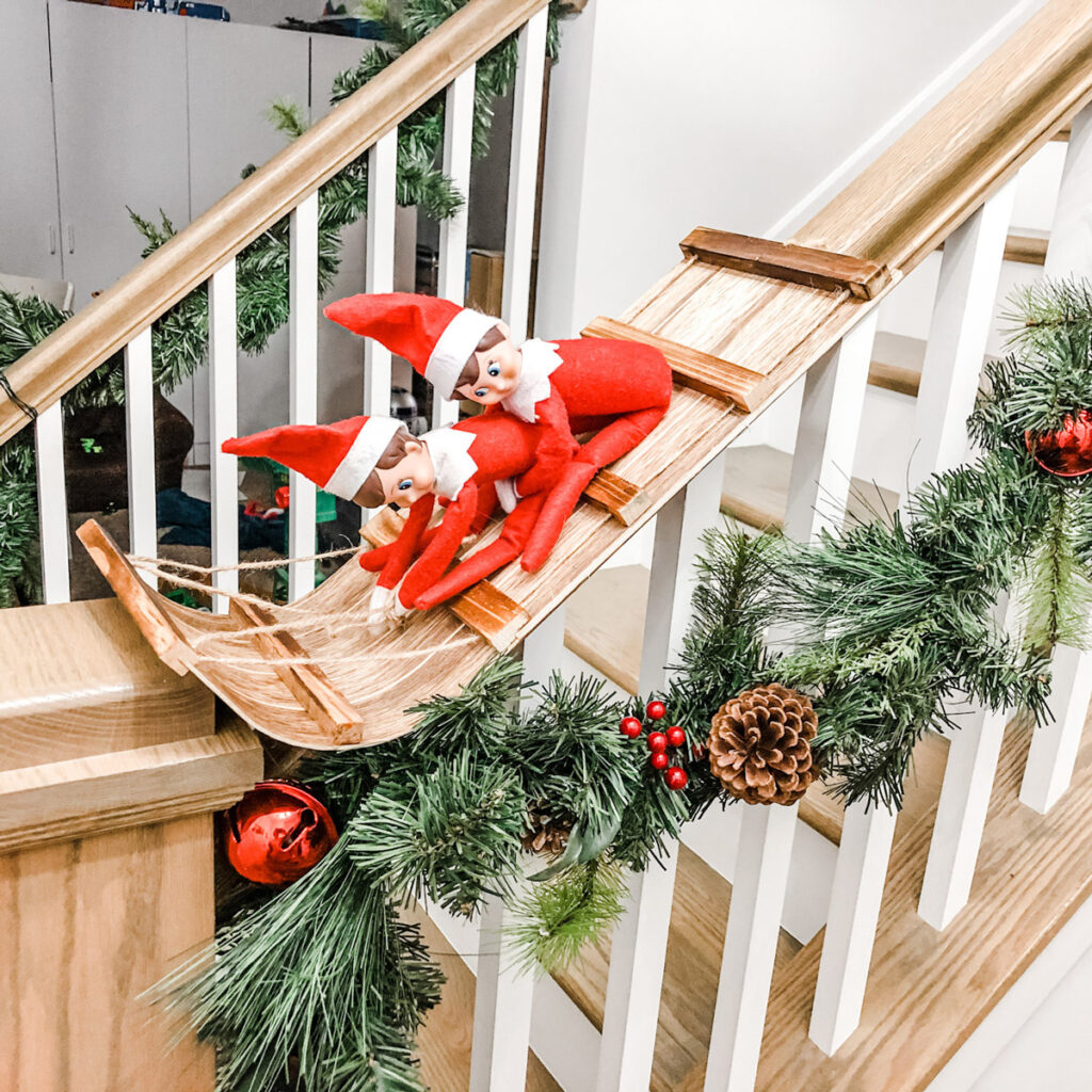 Elf-on-the-Shelf-Ideas-for-Home-Sledding-Square - Mom Envy